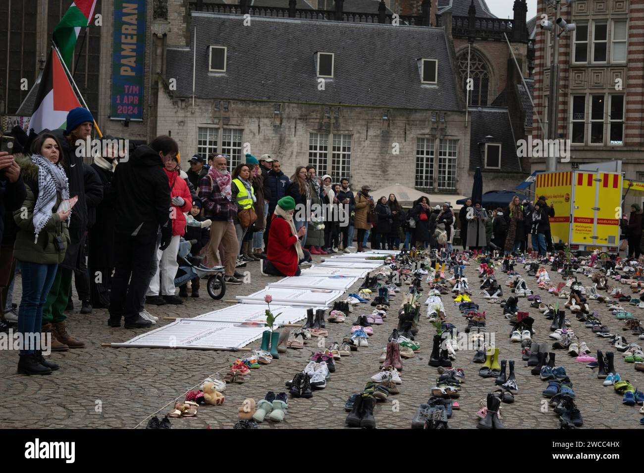 People place thousands of children's shoes are placed on Dam Square ...