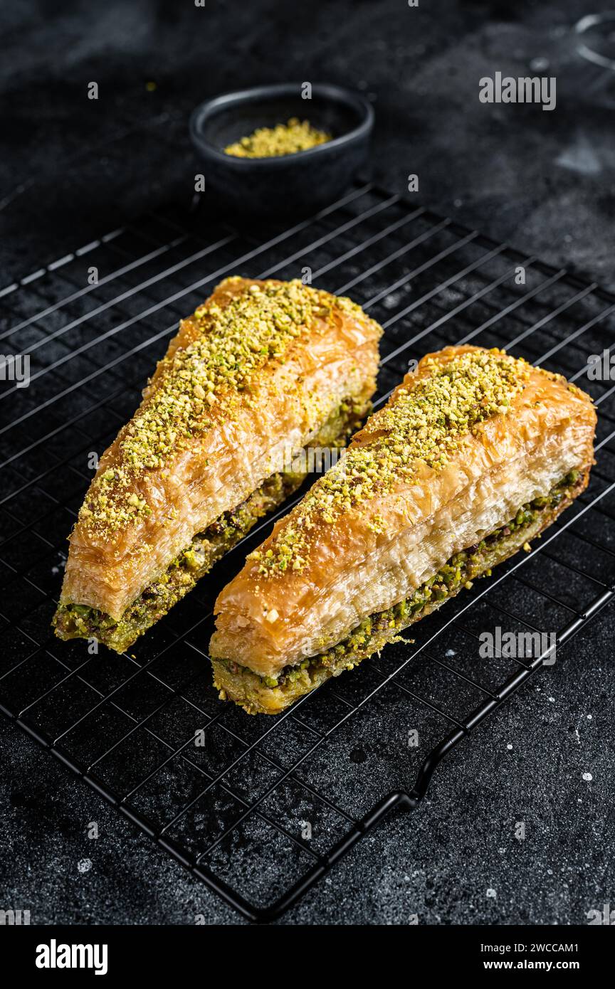 Turkish delights Havuc Dilim Baklava with pistachio and honey. Black ...