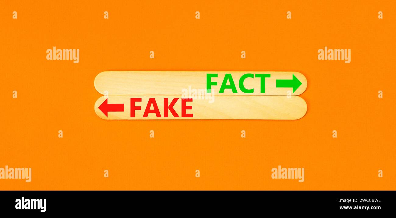 Fact or fake symbol. Concept word Fake and Fact on beautiful wooden ...