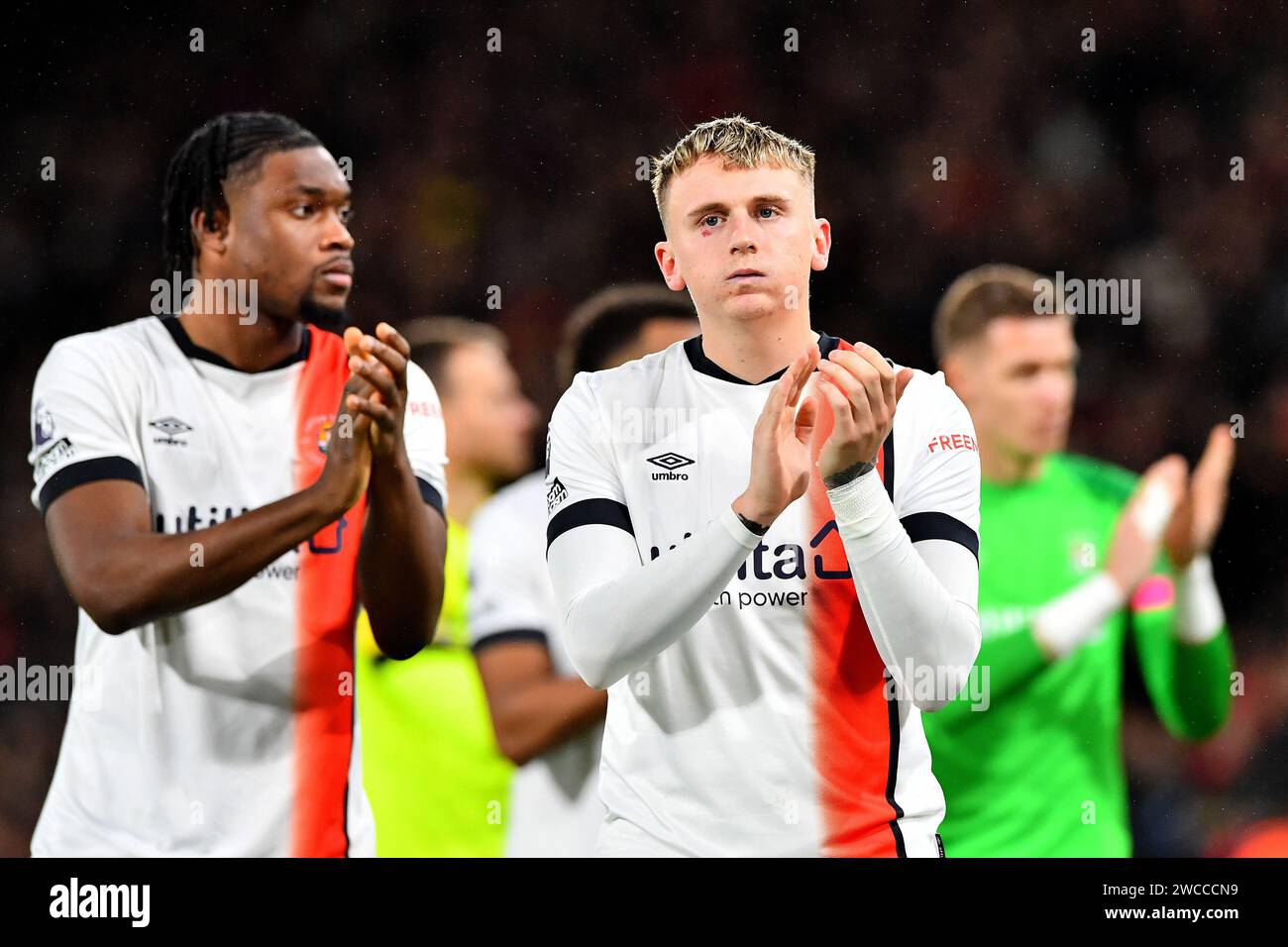 Luton Town players as Tom Lockyer of Luton Town is stretchered off the ...