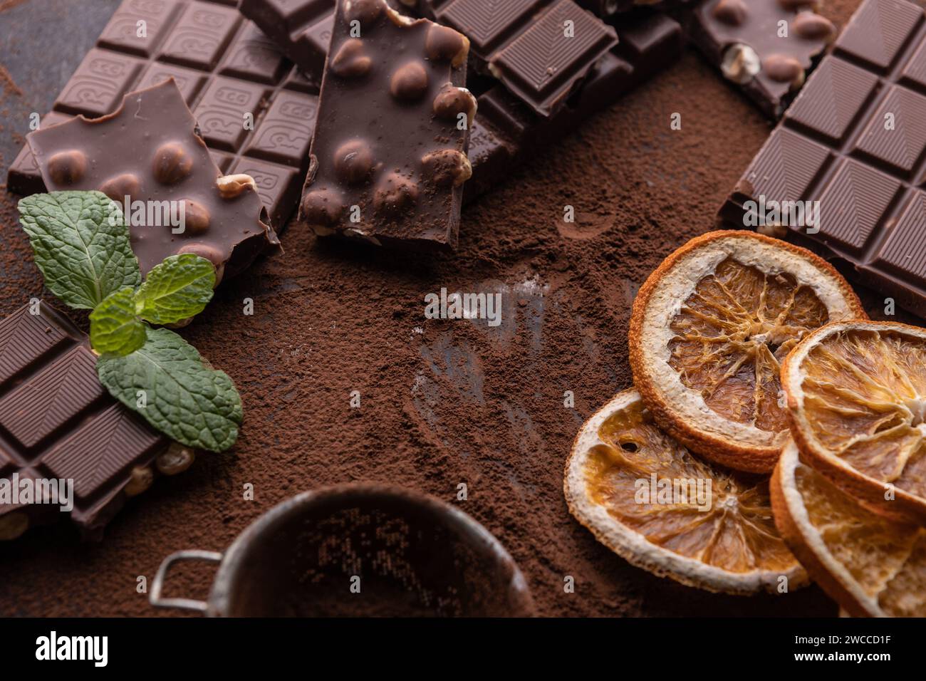 Crushed chocolate on a rustic background. Different types of chocolate ...
