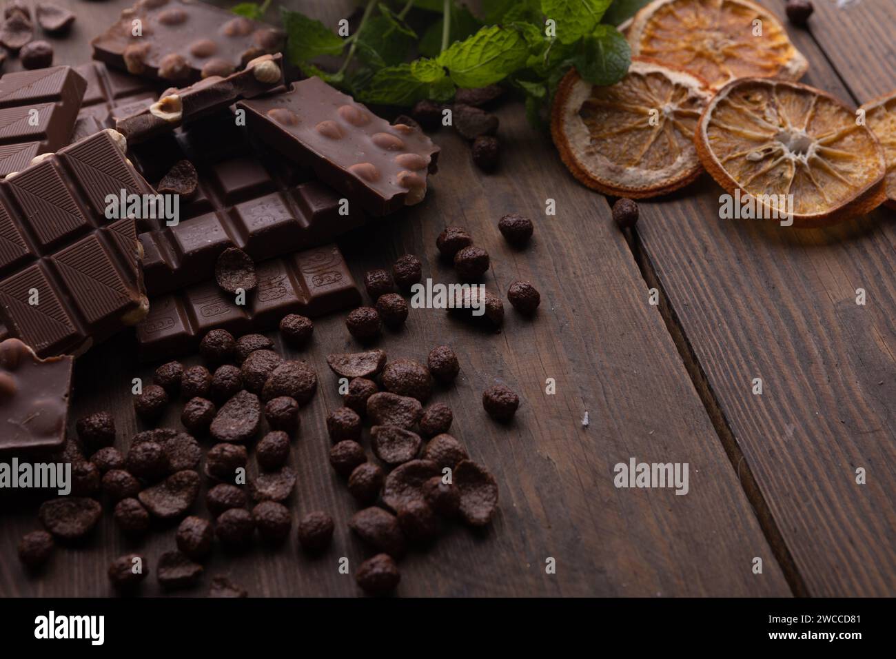 Crushed chocolate on a rustic background. Different types of chocolate ...
