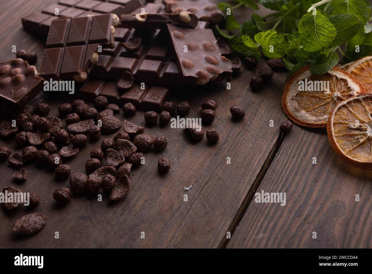 Crushed chocolate on a rustic background. Different types of chocolate ...