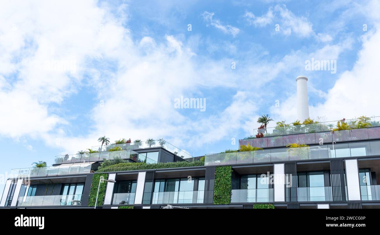 Green building design with large green walls and outdoor urban balcony ...