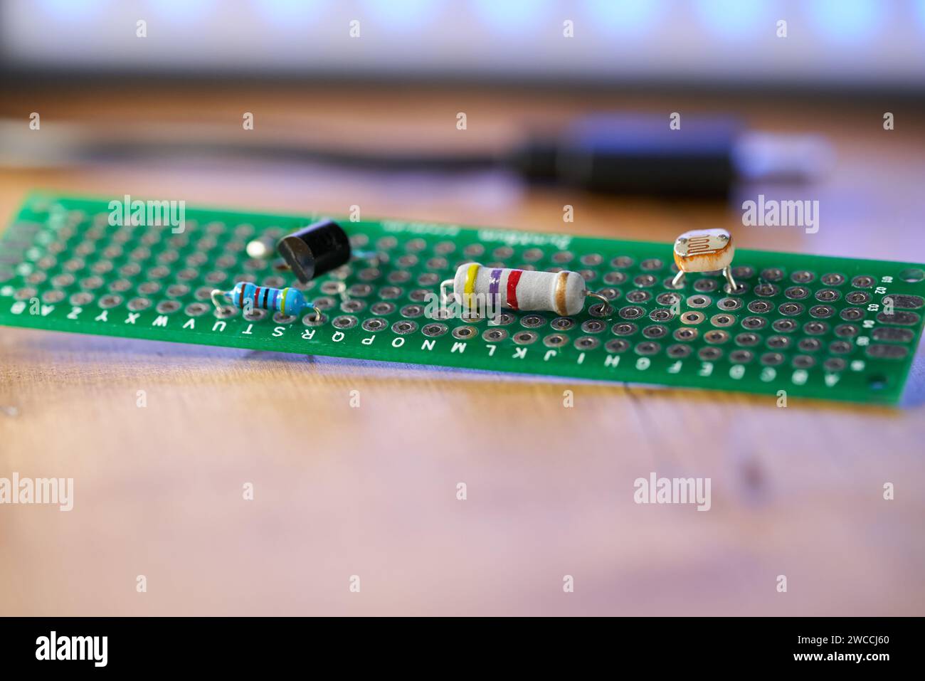 Circuit board with electrical elements, on wooden table Stock Photo - Alamy
