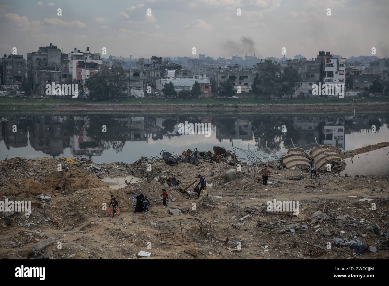Gaza City, Palestinian Territories. 15th Jan, 2024. Palestinians walk ...