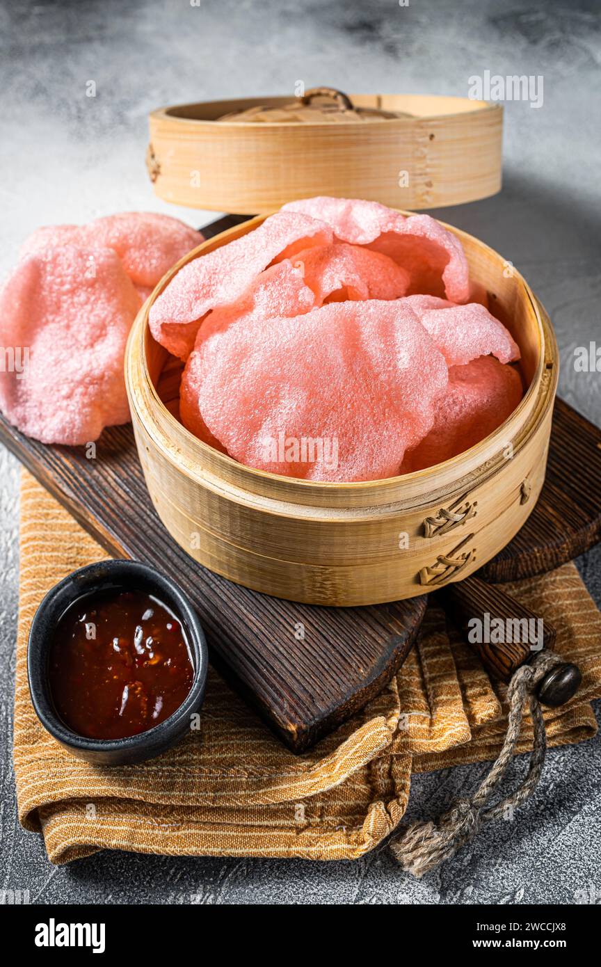 Indonesian prawn shrimp crackers or chips with sauce. White background ...