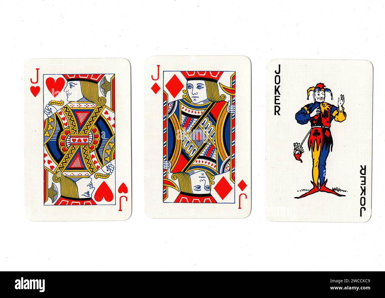 Vintage playing cards showing a pair of red jacks and a joker isolated ...