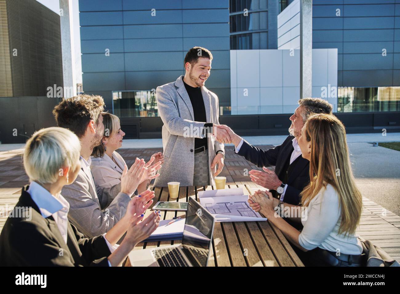 exciting moment captures a team of six individuals engaged in a work ...