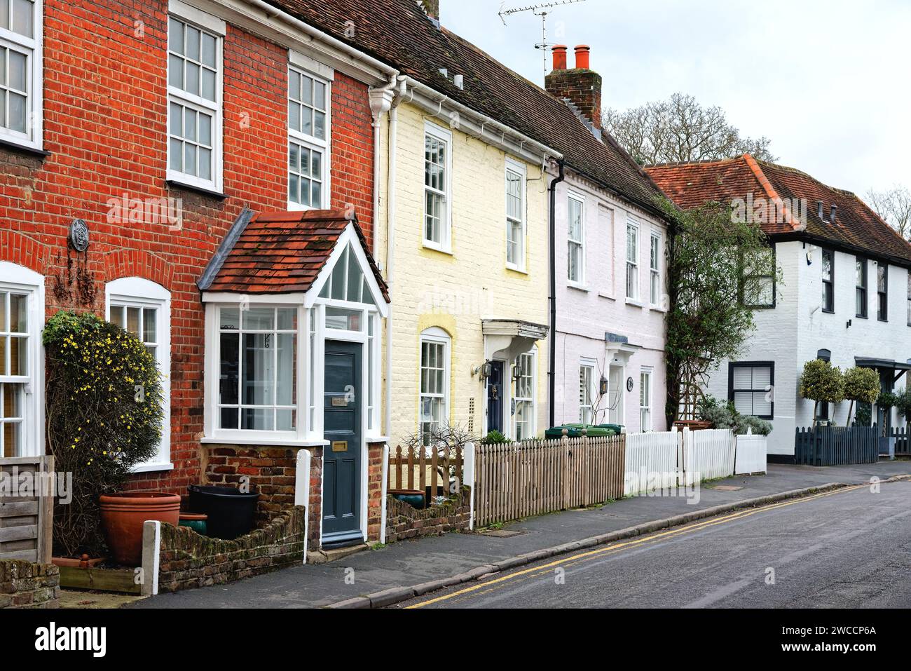 Exteriors of old and attractive terraced cottages painted in pastels ...