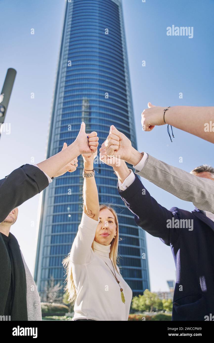 Success, thumbs up and group of people for thank you, support or teamwork hands winning, team in ...