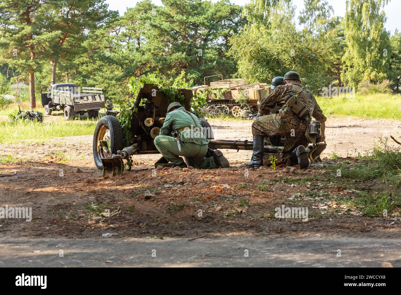 Reconstruction of battle from the Second World War. The crew of a ...