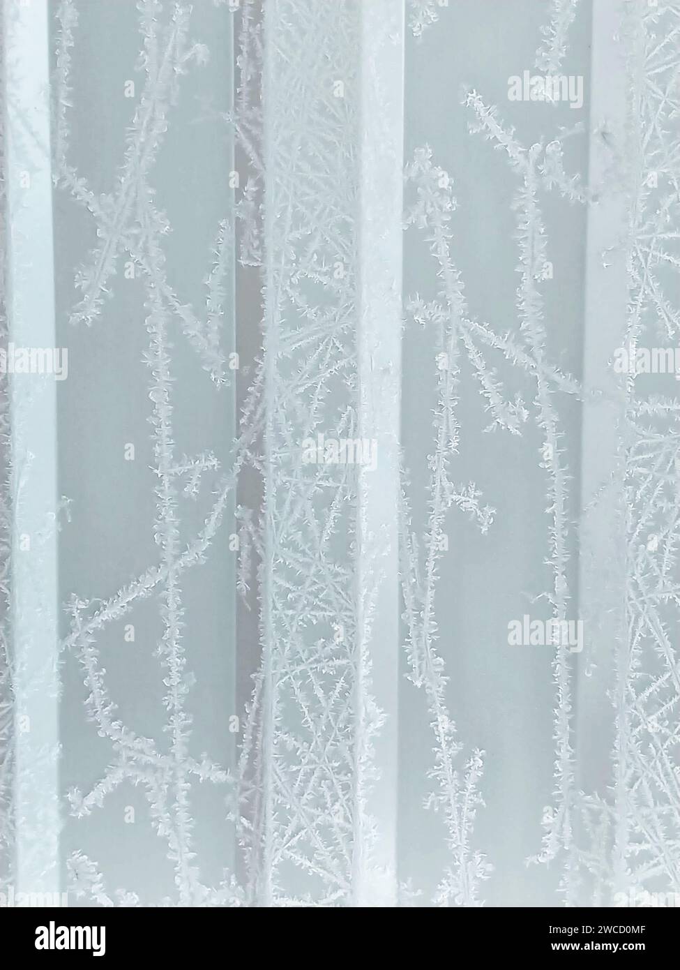 winter vertical frosty background with snow patterns on ribbed texture ...