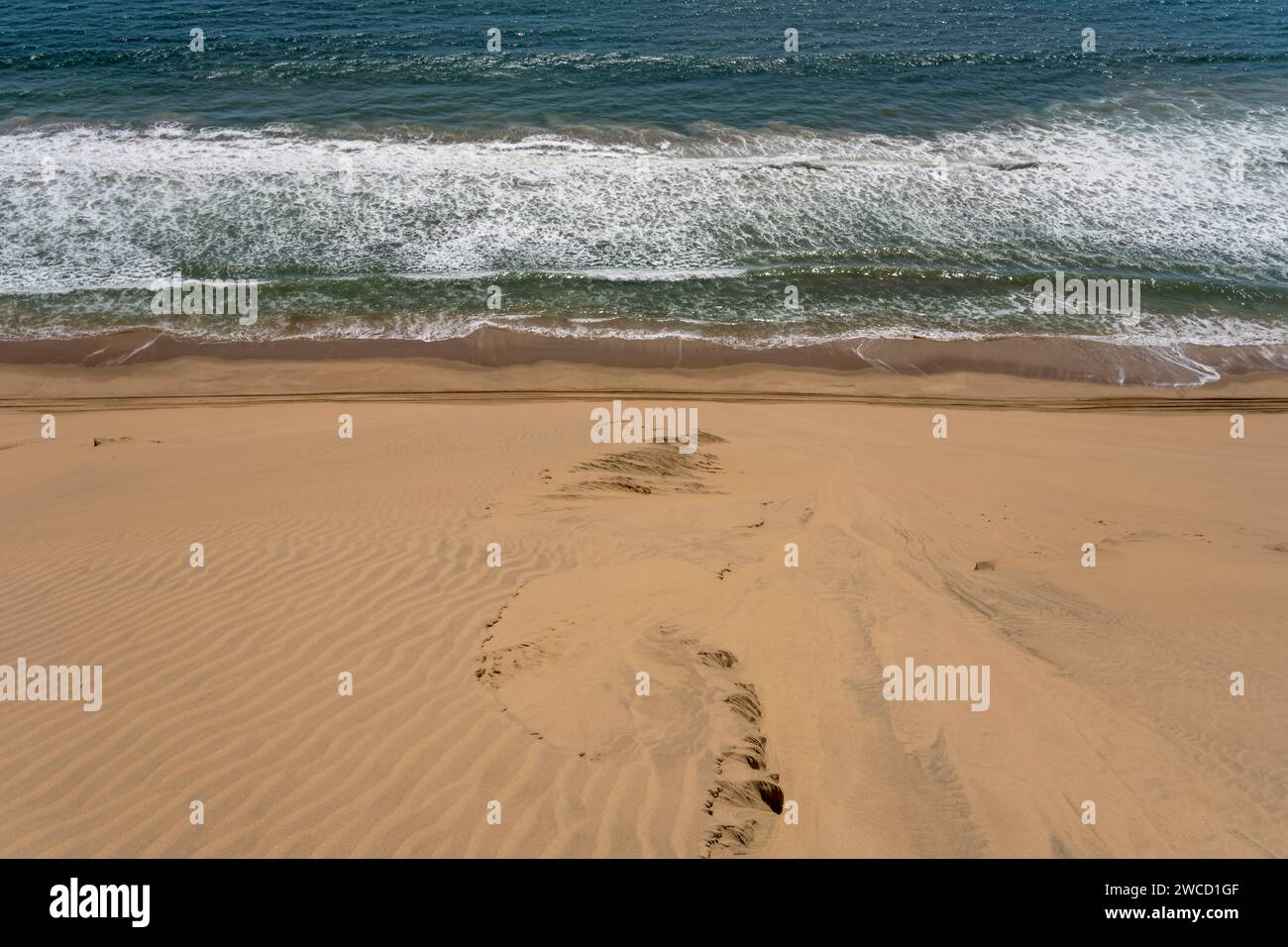 aerial landscape with dune slope and Atlantic waves on beach at ...