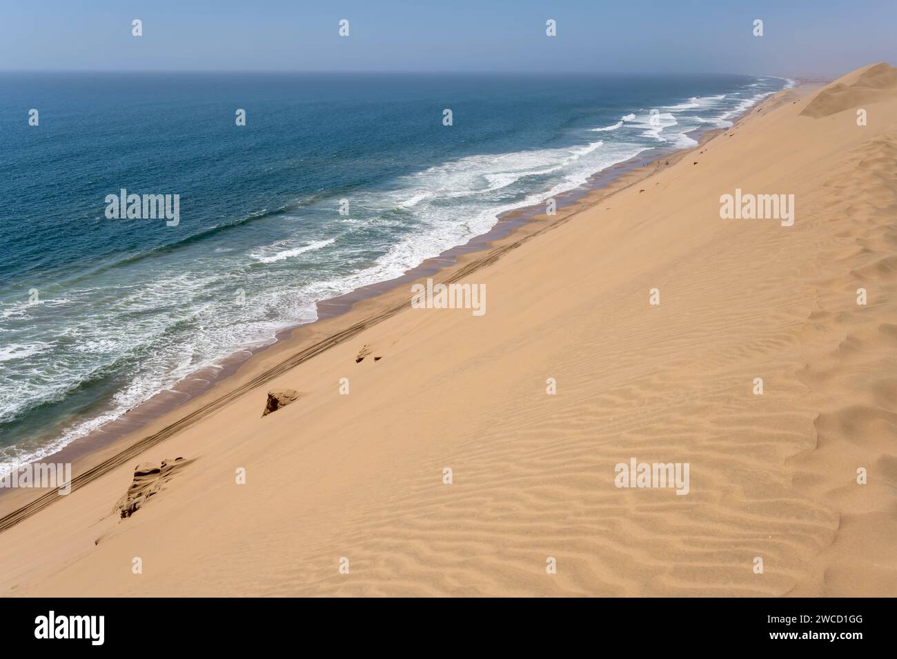 aerial landscape of shore with dune slope and Atlantic waves on beach ...