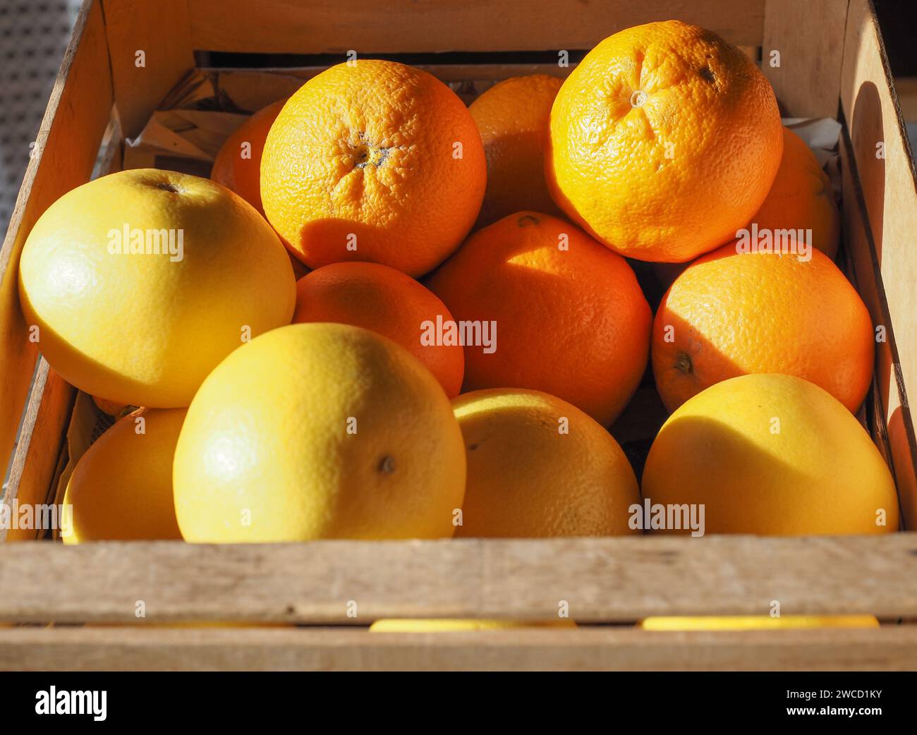 Citrus Fruits Including Oranges And Grapefruit In A Wooden Crate Stock ...