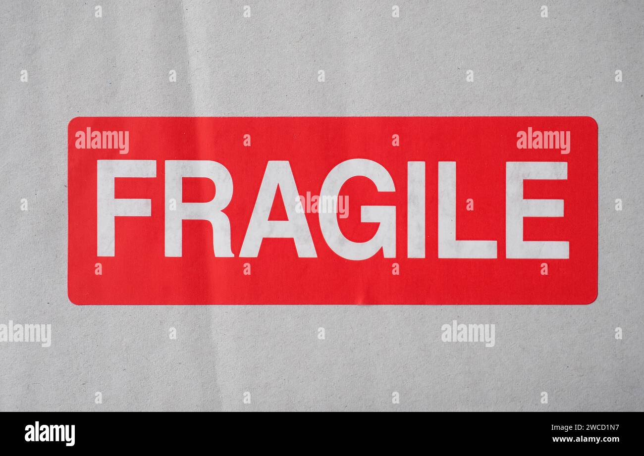 Fragile Warning Sign Label Tag On A Cardboard Box Stock Photo - Alamy