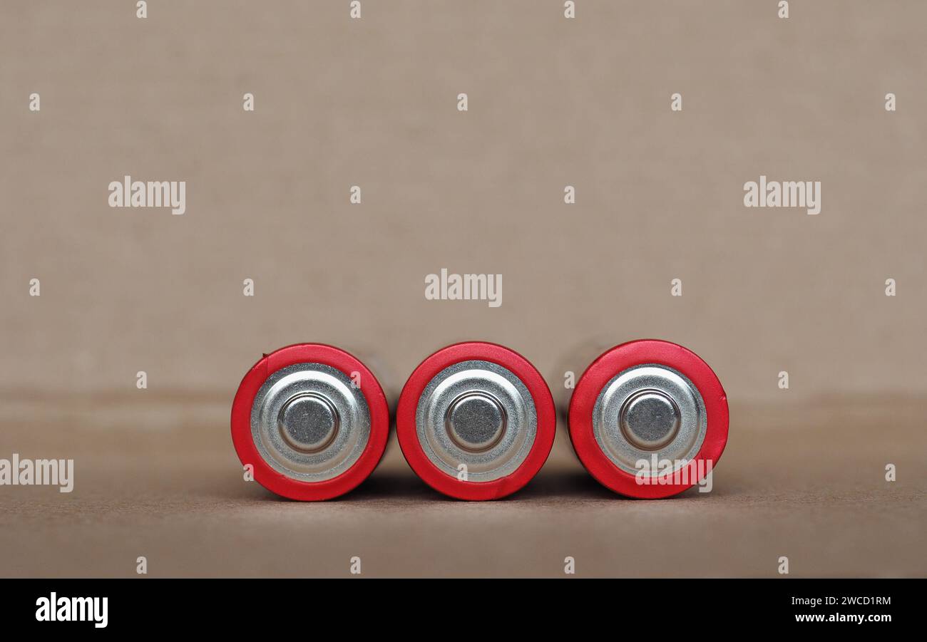 Three Red AA 1.5 V Batteries With Copy Space Stock Photo - Alamy