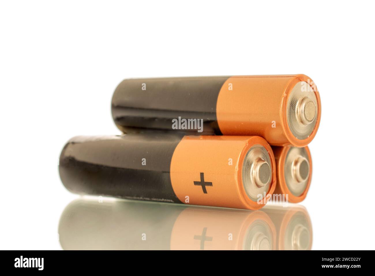 Three batteries, macro, isolated on white background Stock Photo - Alamy