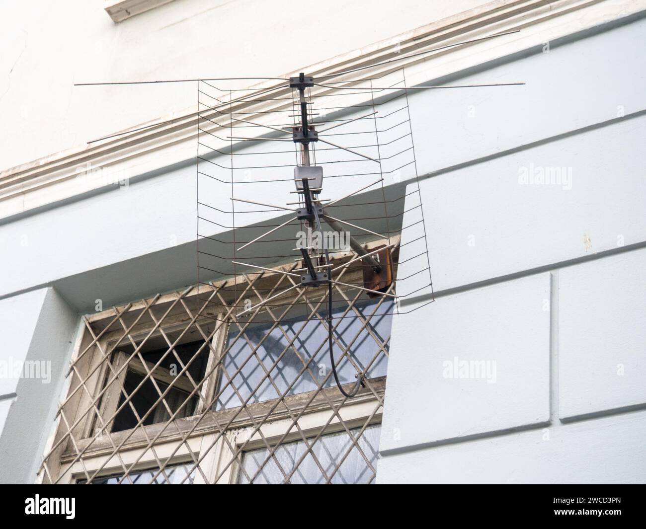 Old antenna on the window. Concept of catching a TV signal. Vintage ...