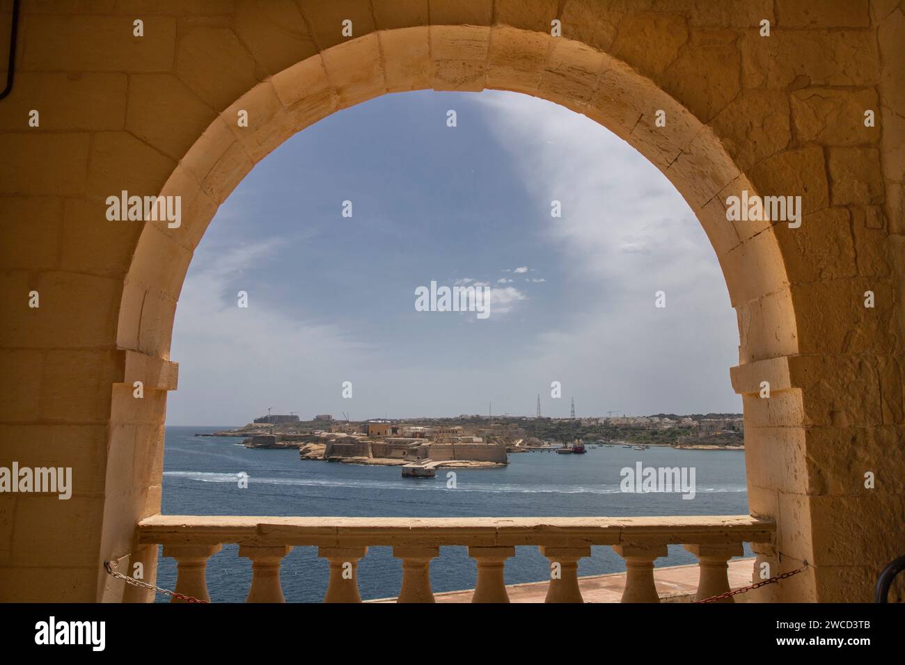 The stunning beauty of the ocean as seen through an elegant arched ...