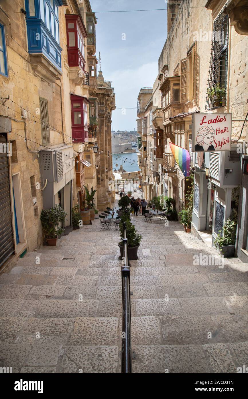A bustling street adorned with an array of diverse shops, buildings ...