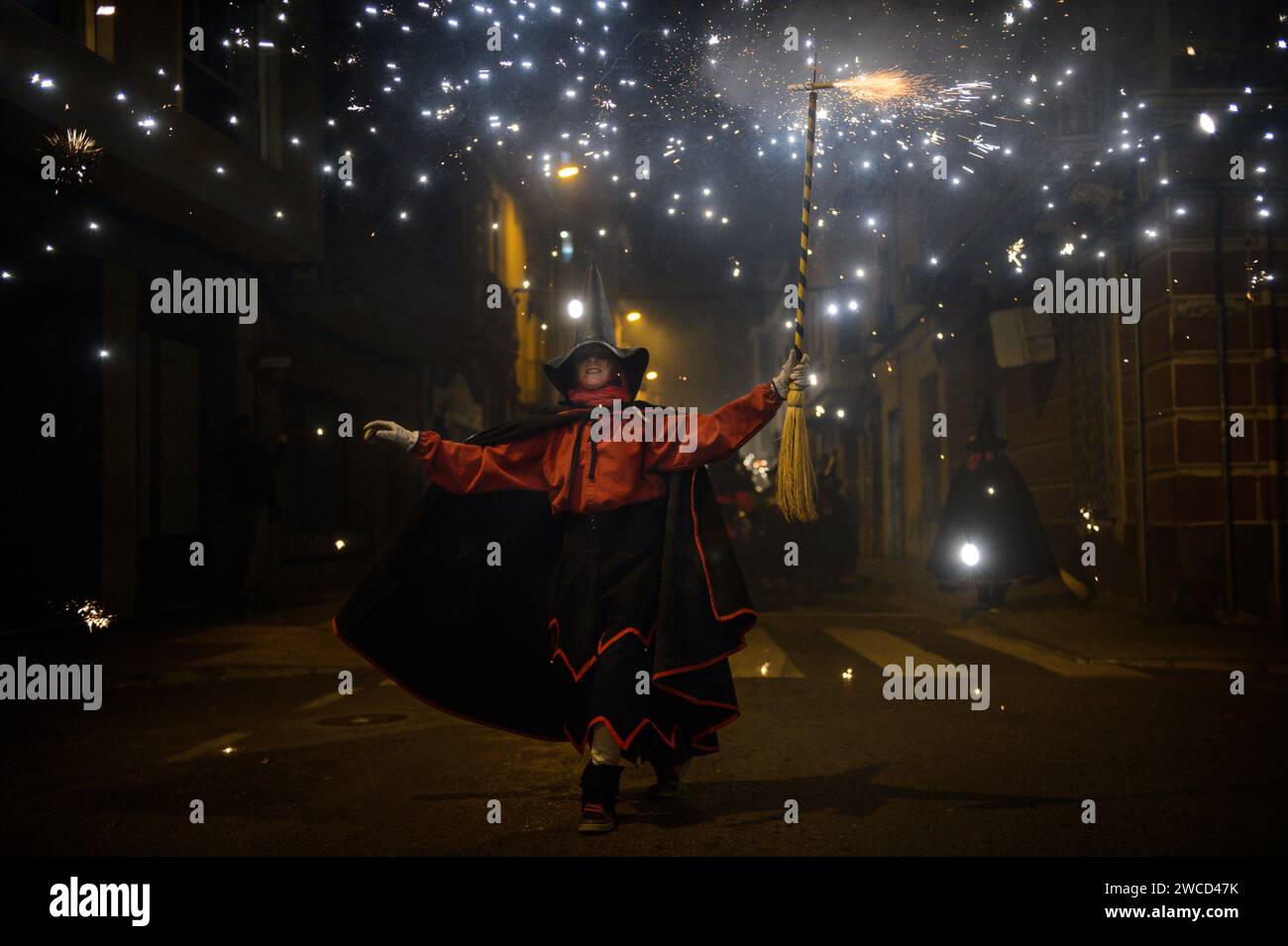 Correfocs (fire runners) through the streets of Sagunto in the ...