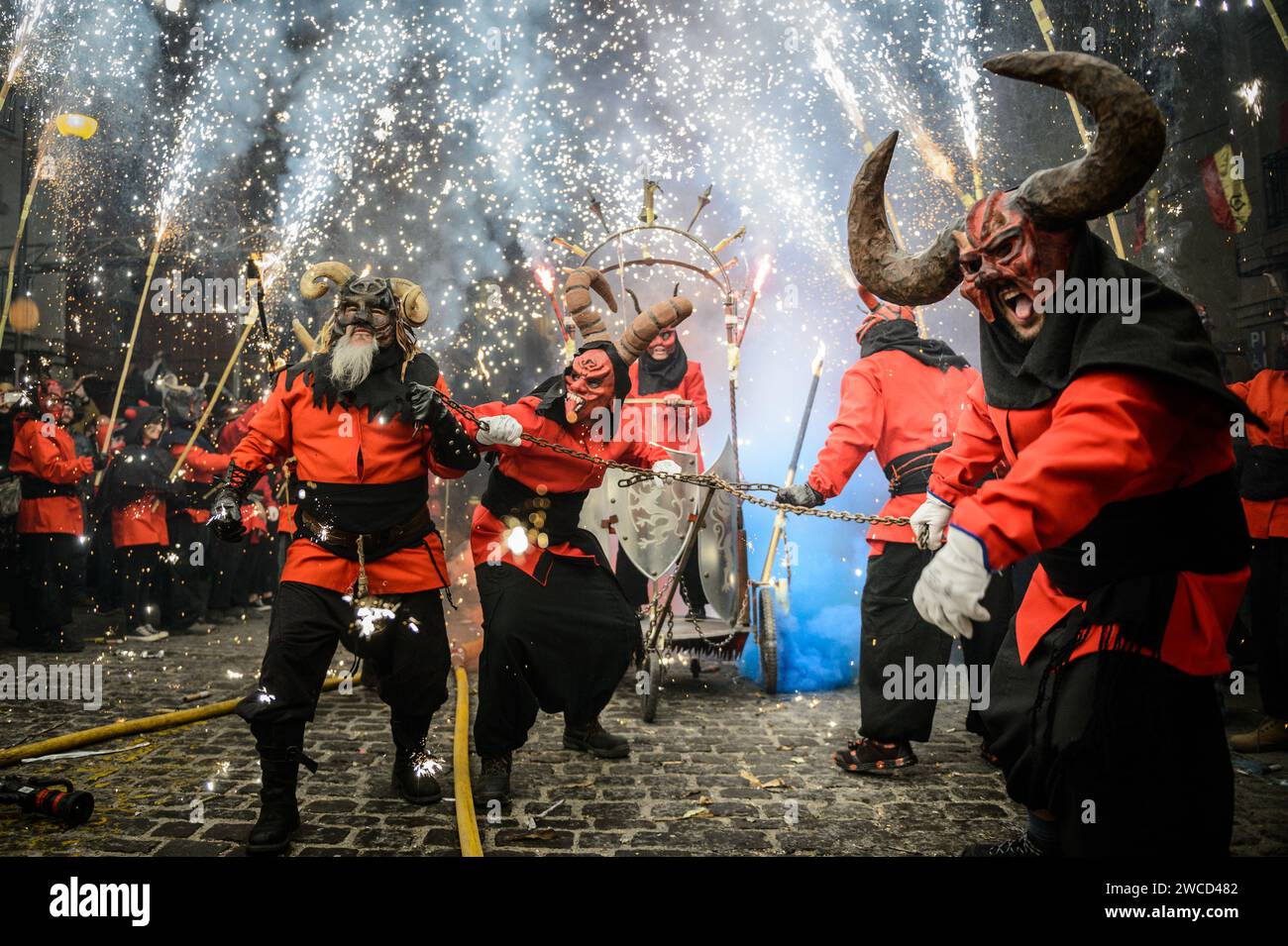 Correfocs (fire runners) through the streets of Sagunto in the ...