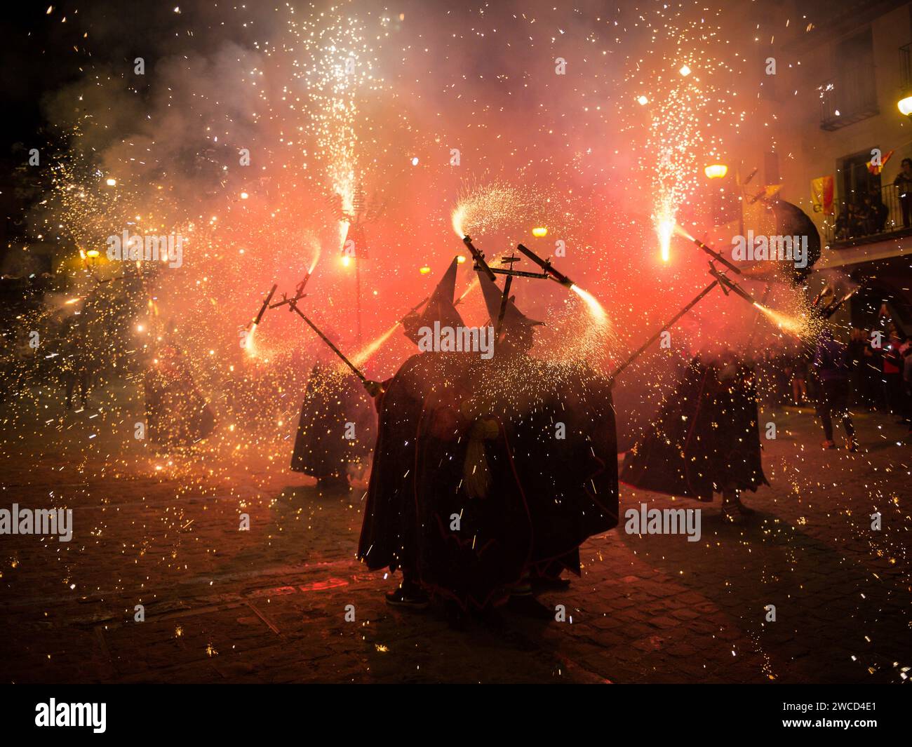 Correfocs (fire runners) through the streets of Sagunto in the ...