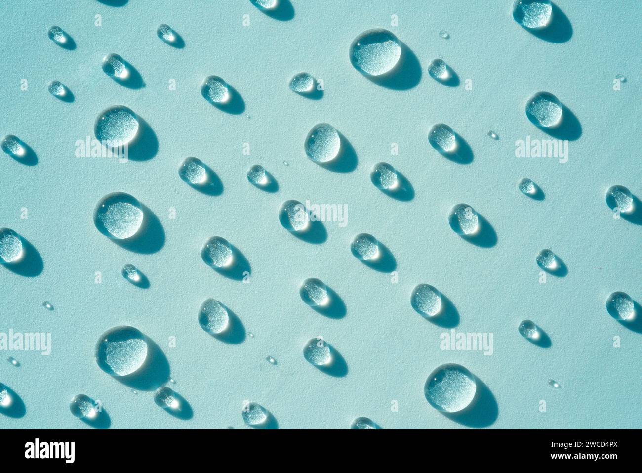 Blue drops of pure liquid, transparent water background Stock Photo - Alamy