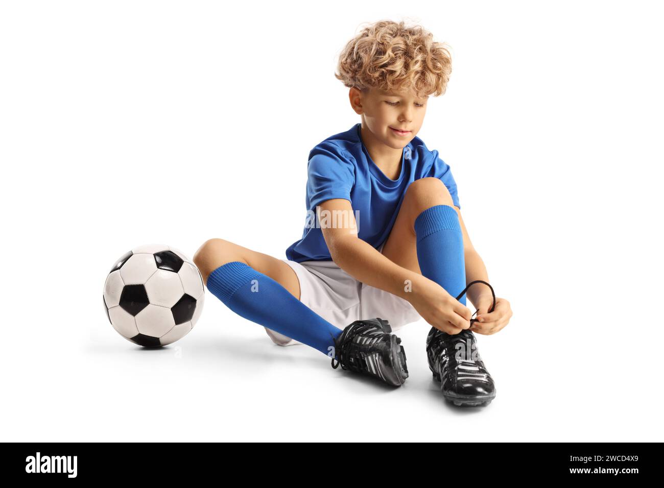 Child putting on shoe Cut Out Stock Images & Pictures - Alamy