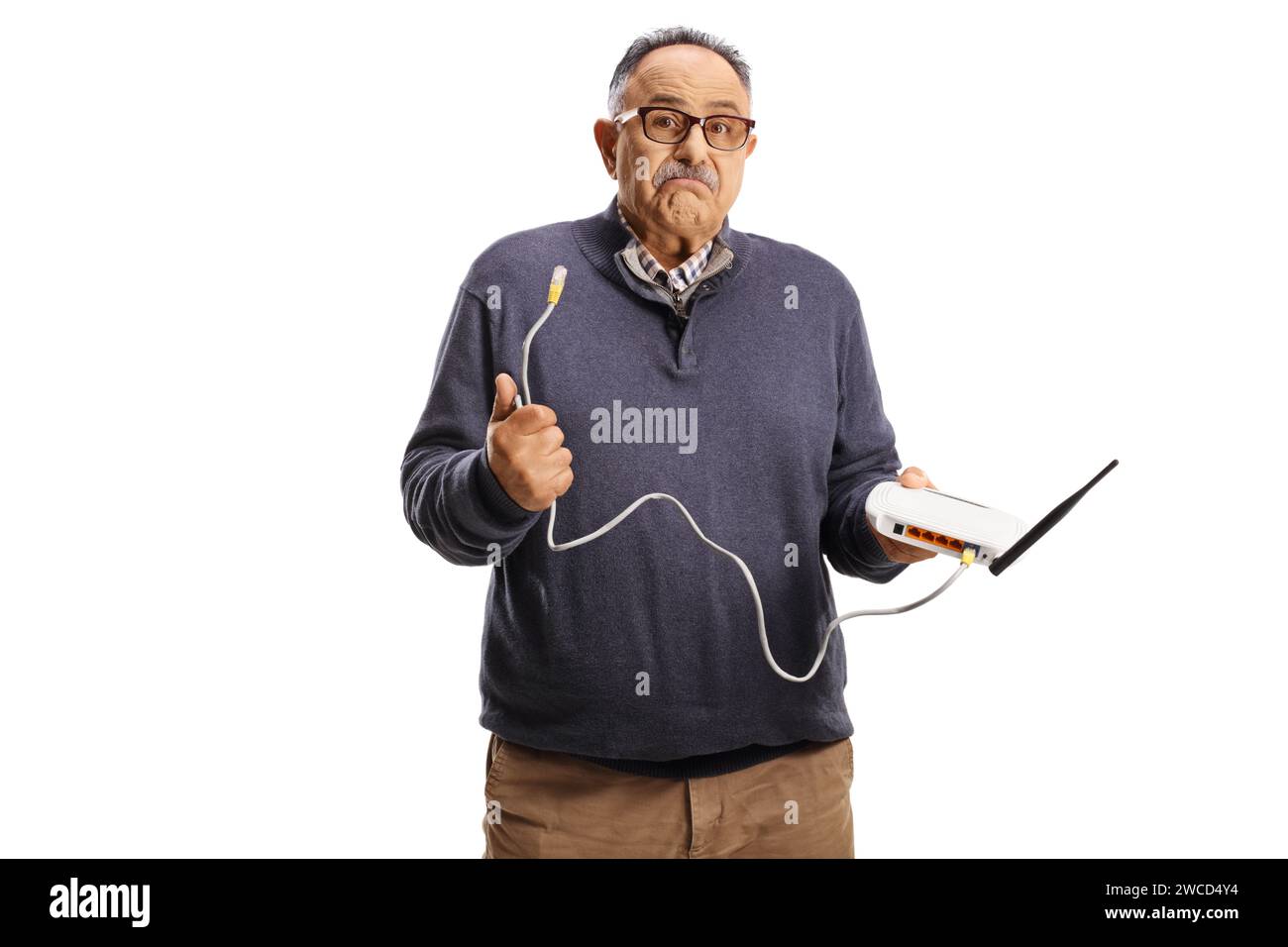 Confused mature man holding a router cable isolated on white background ...