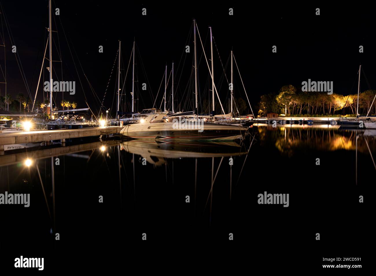 Long-exposure photo at a harbor, featuring a captivating view of boats ...