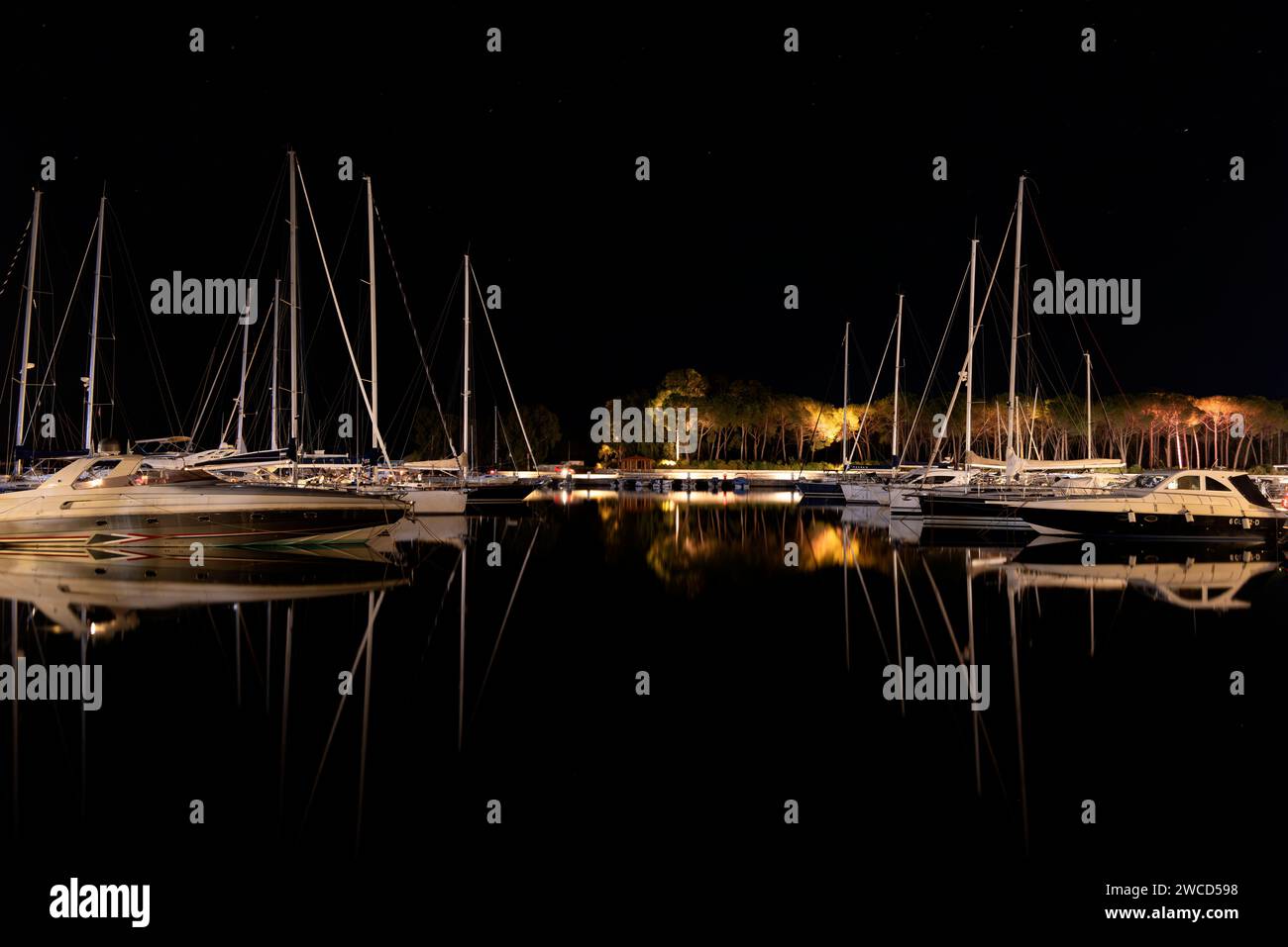 Long-exposure photo at a harbor, featuring a captivating view of boats ...