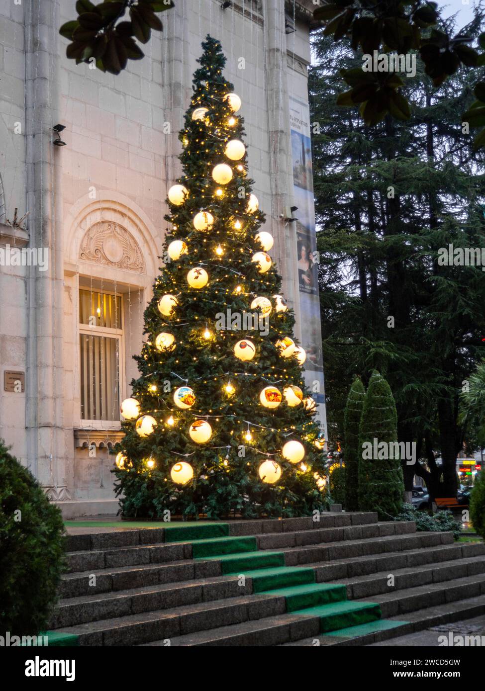An artificial Christmas tree with large balls near a government office ...