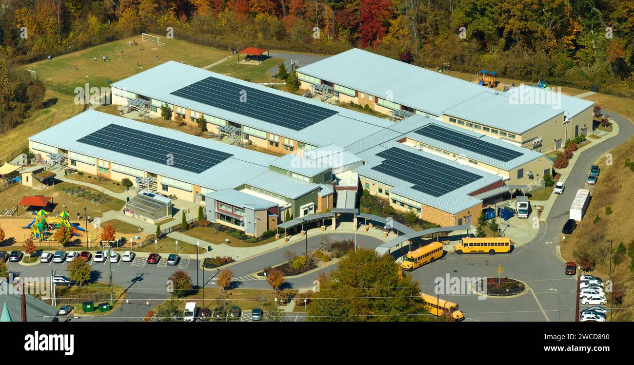 Aerial view of american school building with rooftop covered with ...