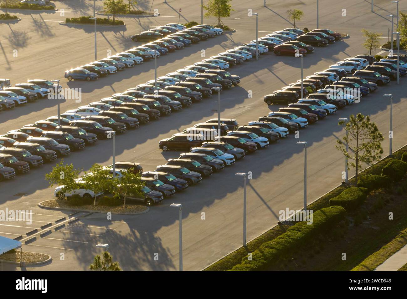 Aerial view of dealership parking lot with many brand new cars for sale ...