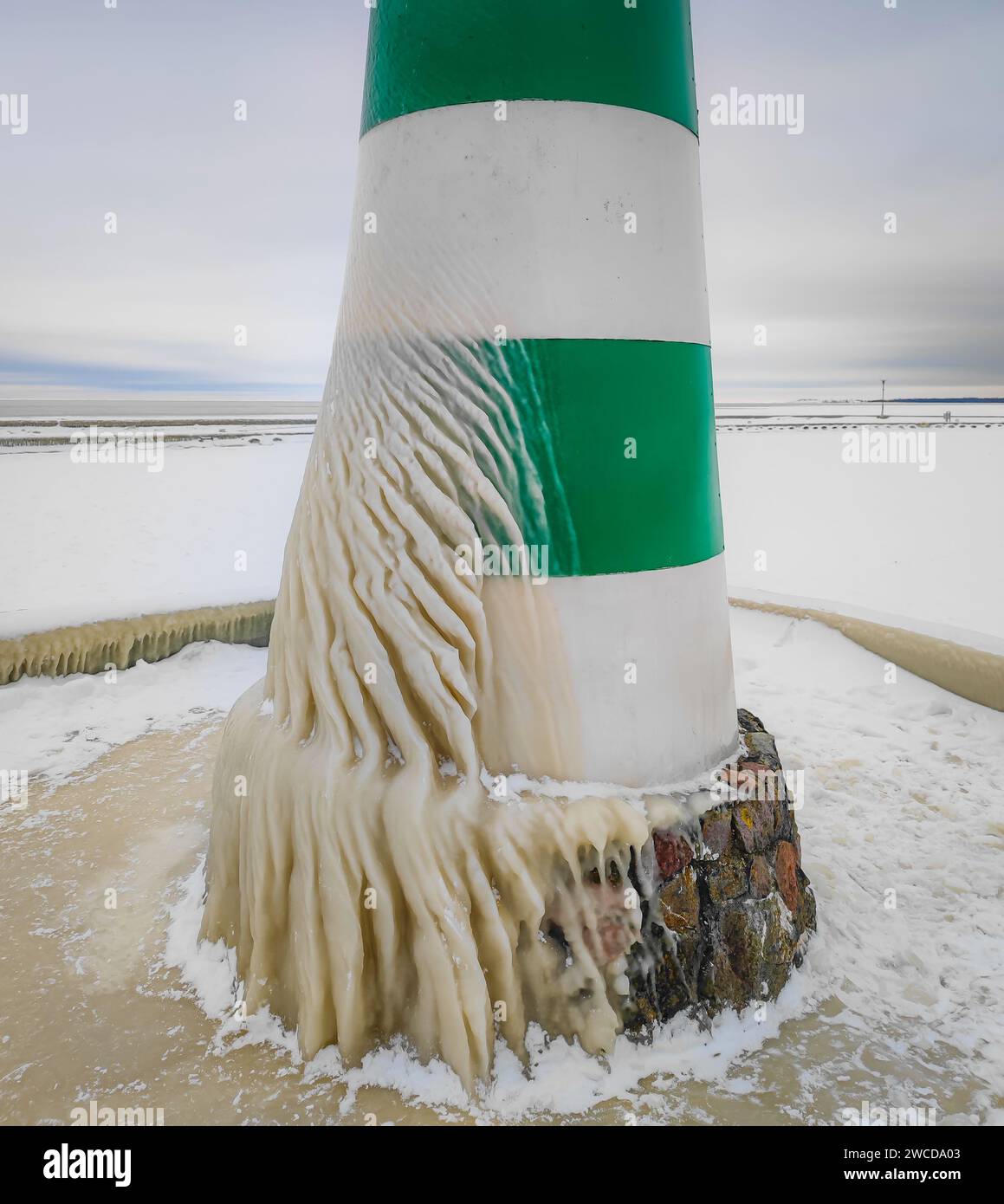 Spectacular ice formations on a lighthouse cold and windy day. Natural ...