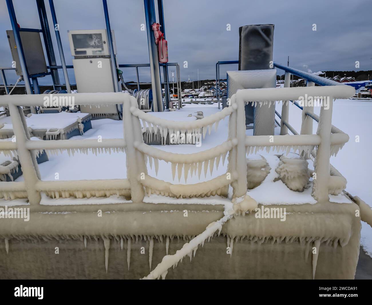 Spectacular ice formations on a boat petrol station cold and windy day ...