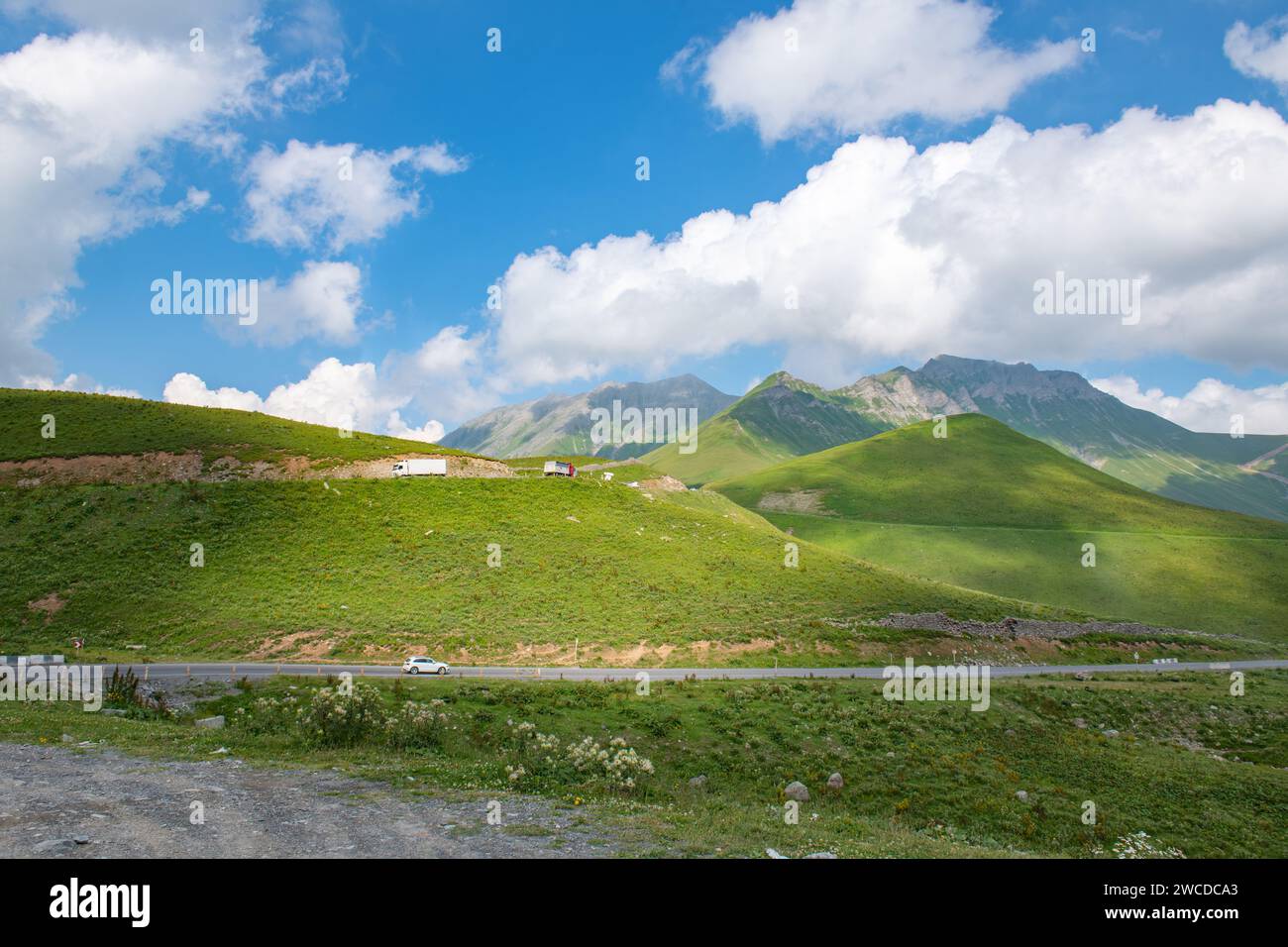 Pure Elevation: Green Mountains Adorned with Blue Canopies Stock Photo ...