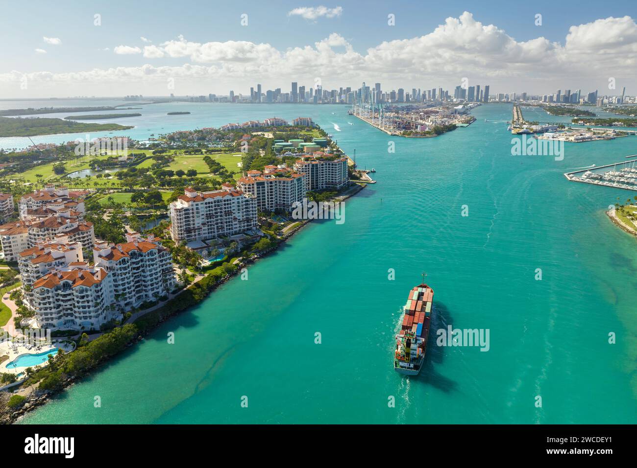 Commercial container ship entering Miami port harbor through main ...