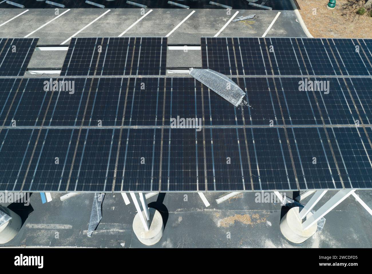 Destroyed by hurricane wind solar panels installed over parking lot ...
