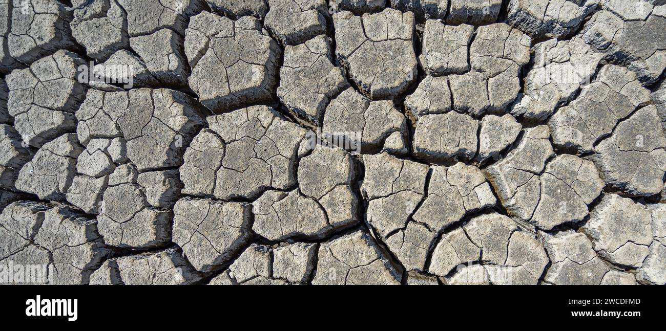 cracked floor of dry river where sludge was. Representation of a period ...