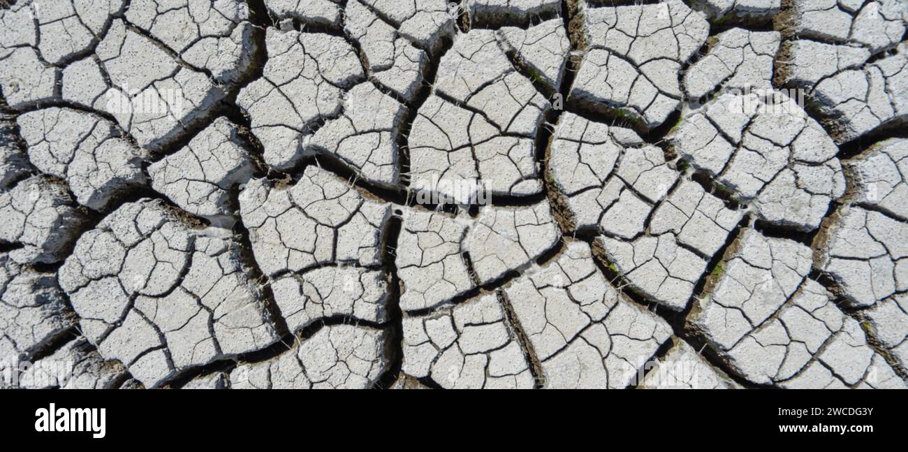 cracked floor of dry river where sludge was. Representation of a period ...