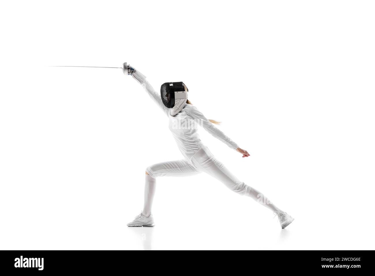 A fencer in full gear lunging with precision, isolated on a white ...