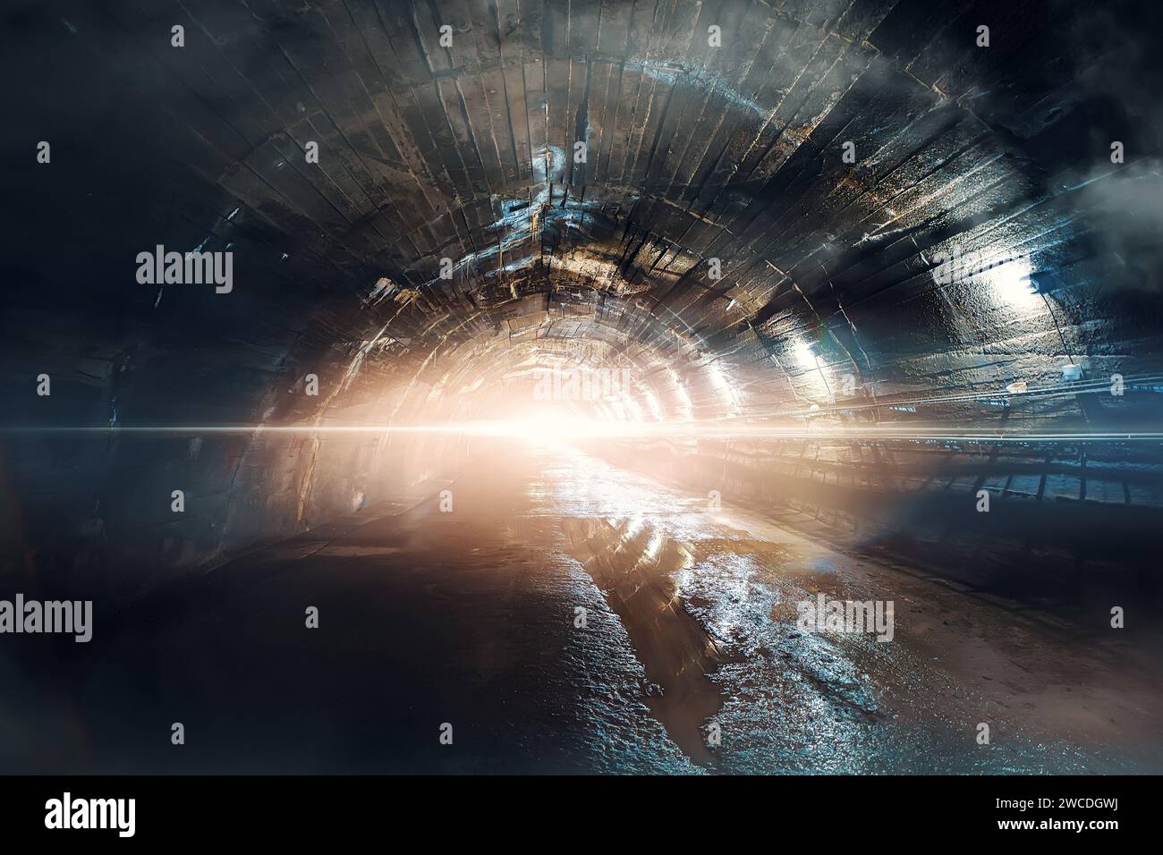 Bright light in end of old wet underground tunnel Stock Photo - Alamy