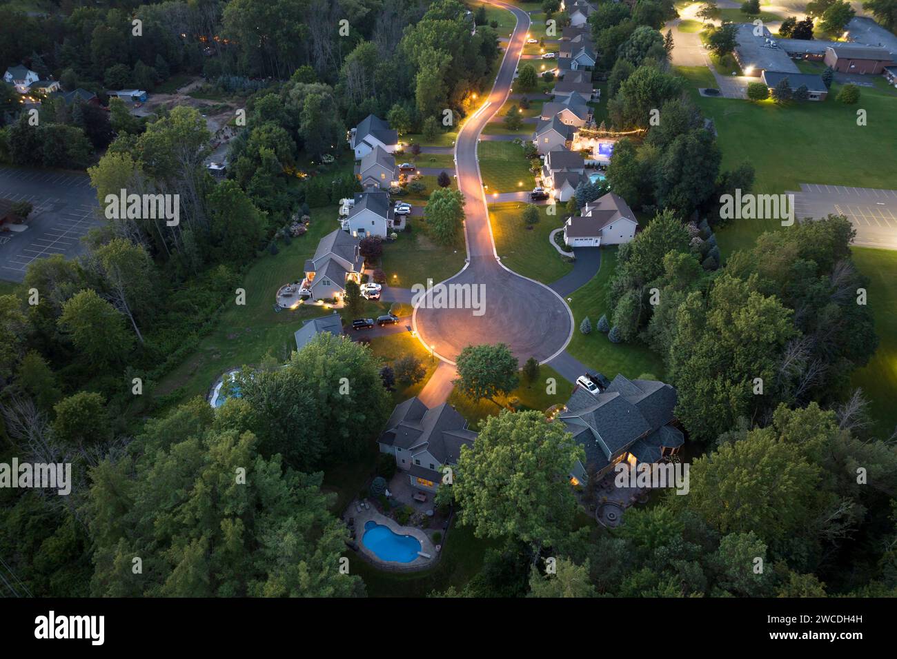 Low-density two story private homes at night. Rural street cul-de-sac ...