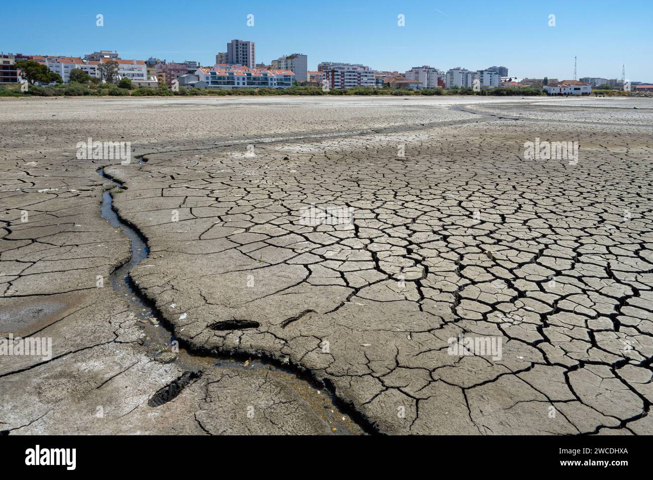 cracked floor of dry river where sludge was. Representation of a period ...