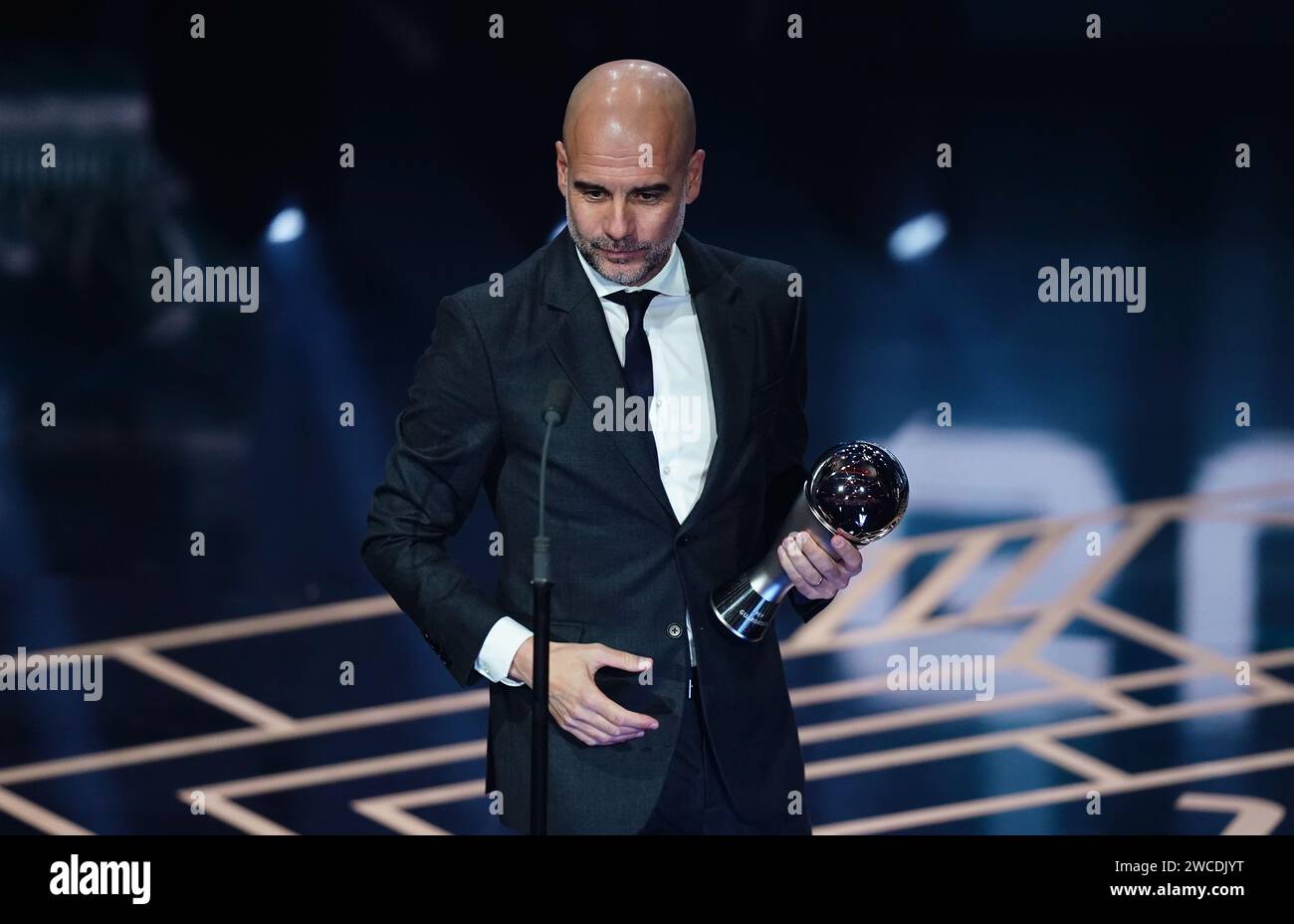 Pep Guardiola with the award for The Best FIFA Men's Coach on stage ...
