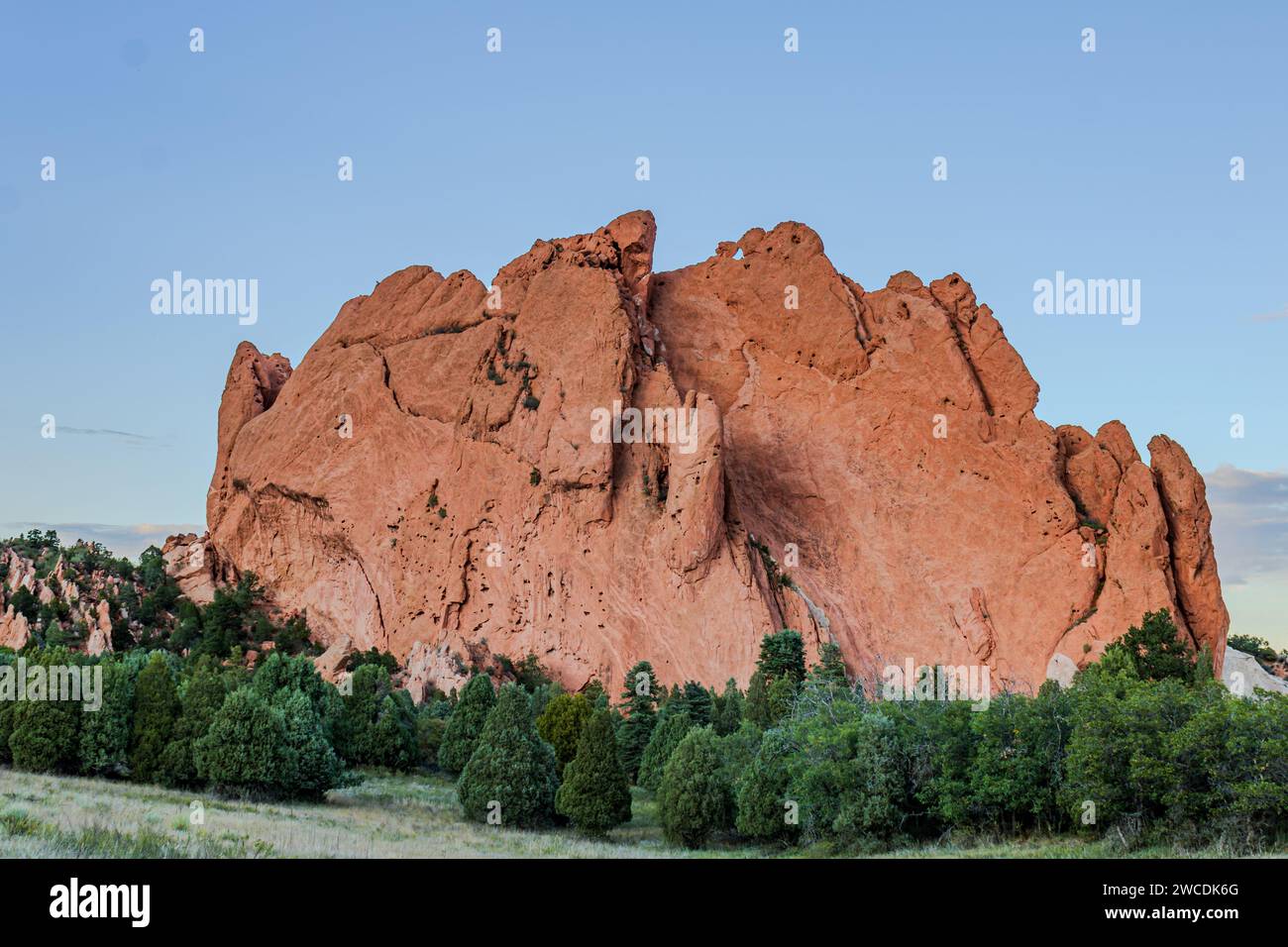 Early morning light on a dramatic red sandstone rock formation ...